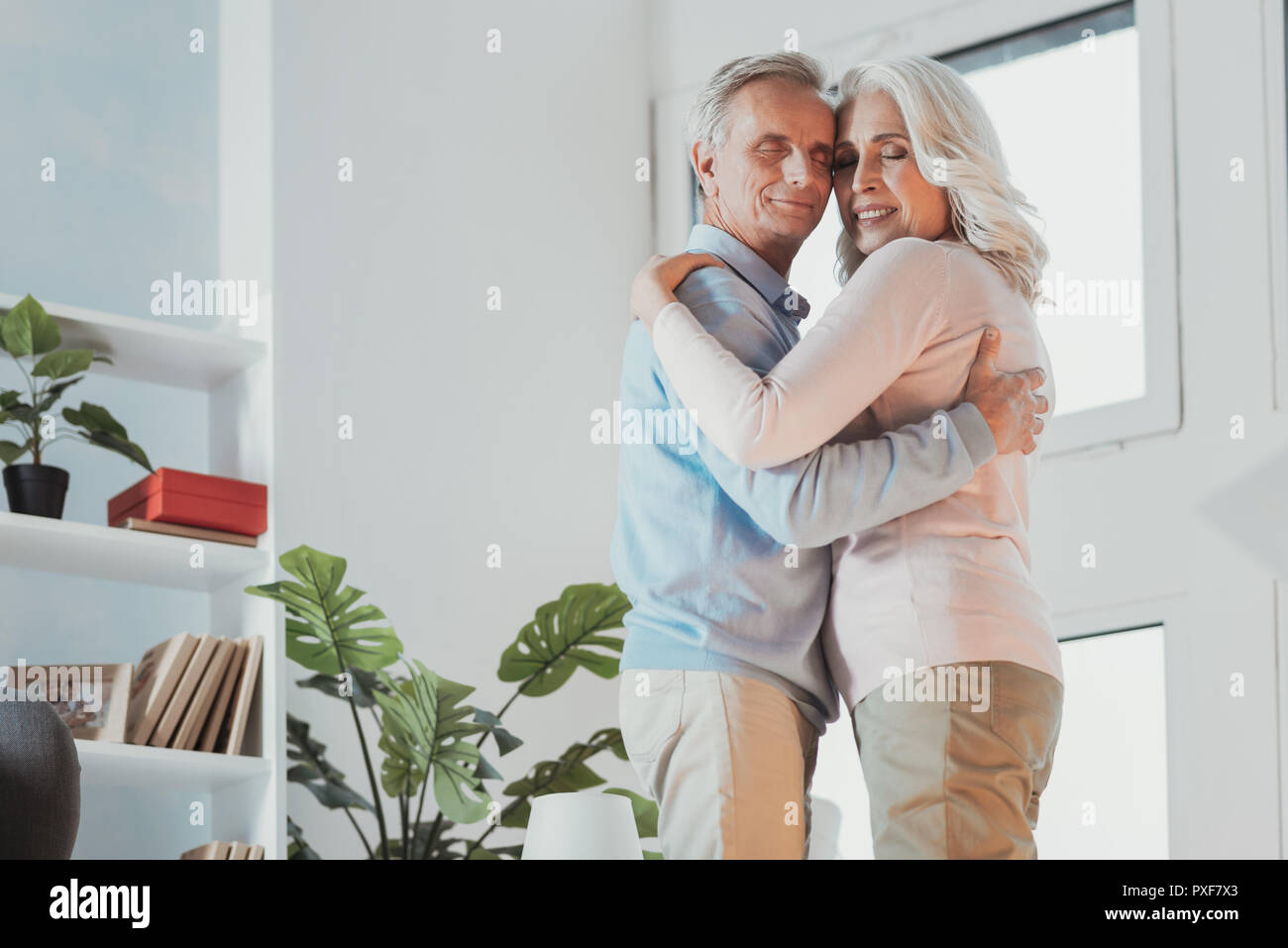 Cheerful senior spouses hugging and dancing Stock Photo - Alamy