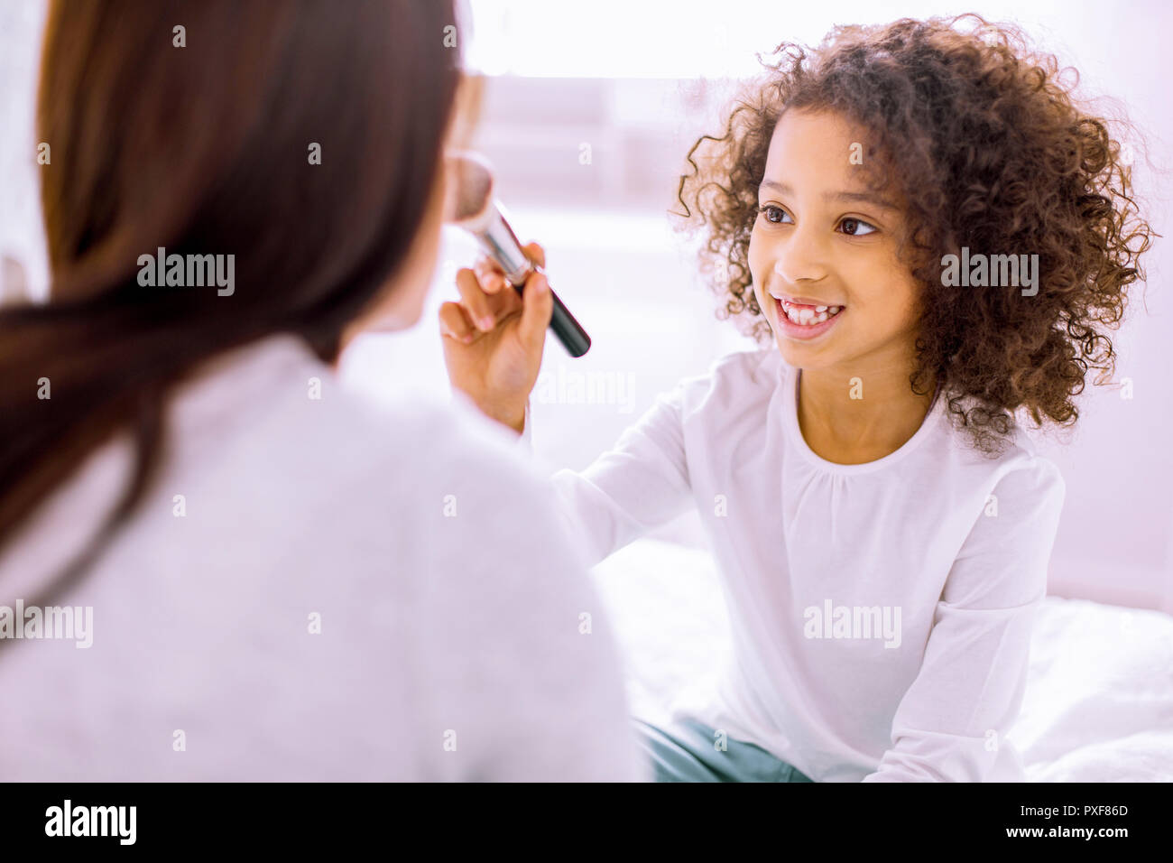 Woman powdering her nose hi-res stock photography and images - Alamy