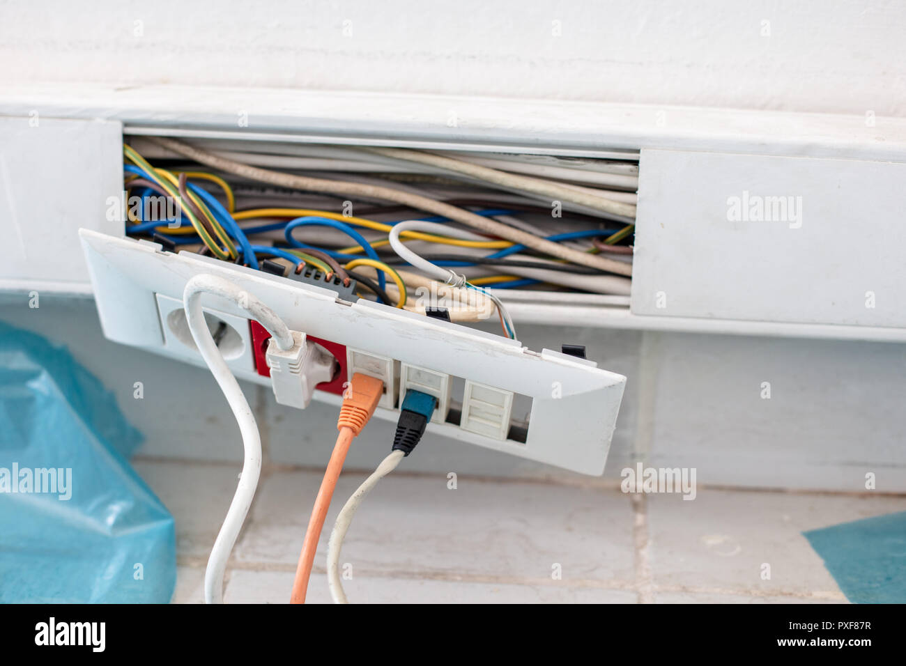 Plactic cable channel while repairing with electrical outlets on where ...