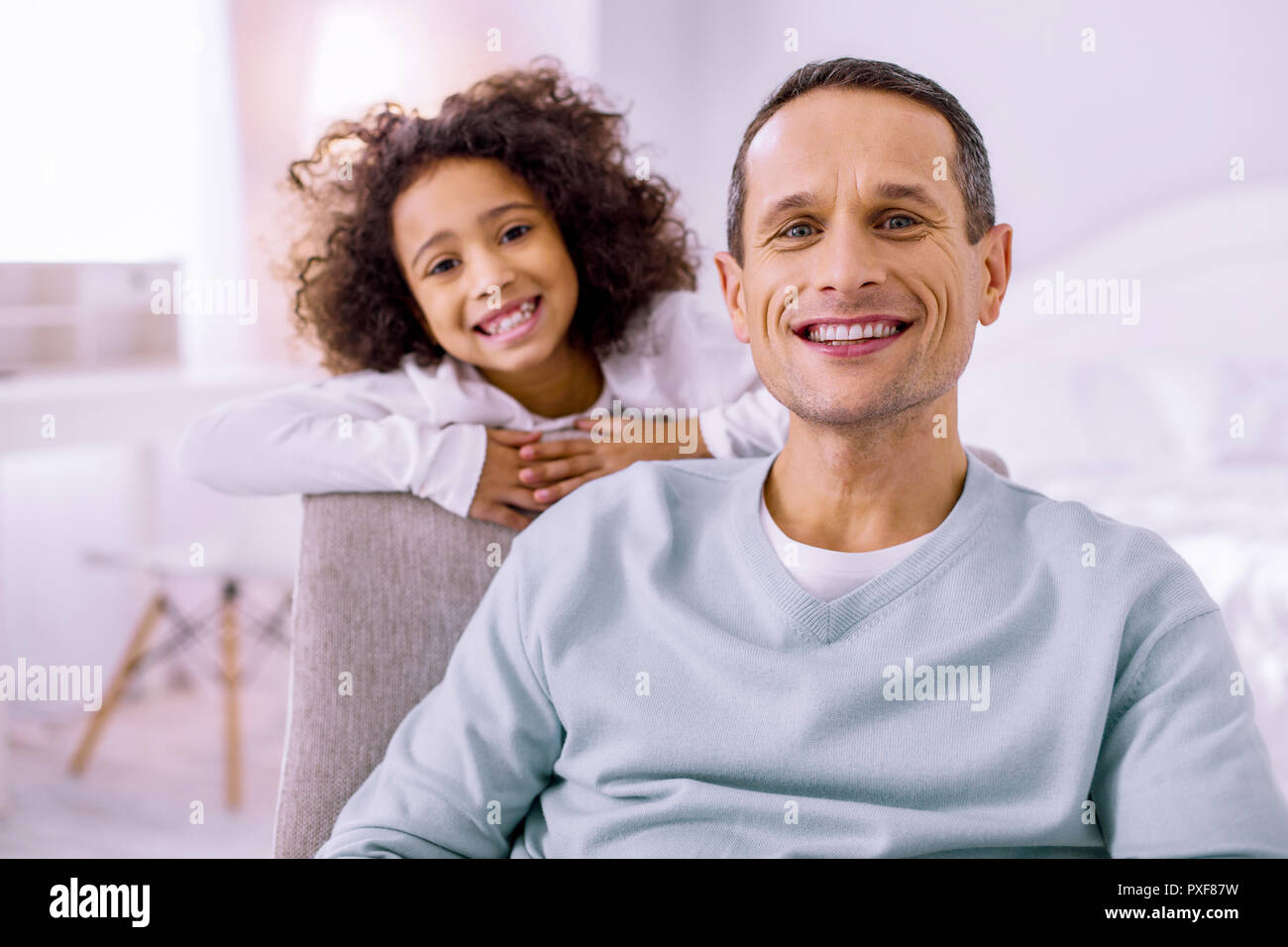Positive delighted male person keeping smile on his face Stock Photo ...
