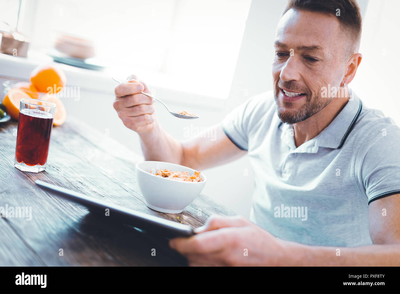 Joyful positive man being in a good mood Stock Photo - Alamy
