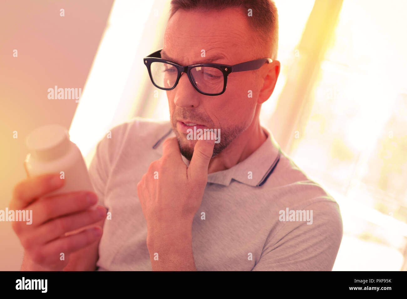 Doubtful attractive man being a little bit confused Stock Photo - Alamy