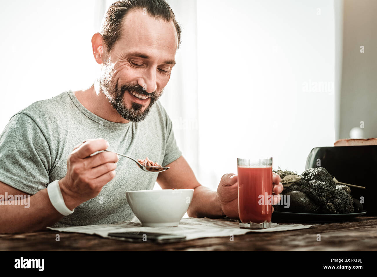 Man eating breakfast alone close hi-res stock photography and images ...