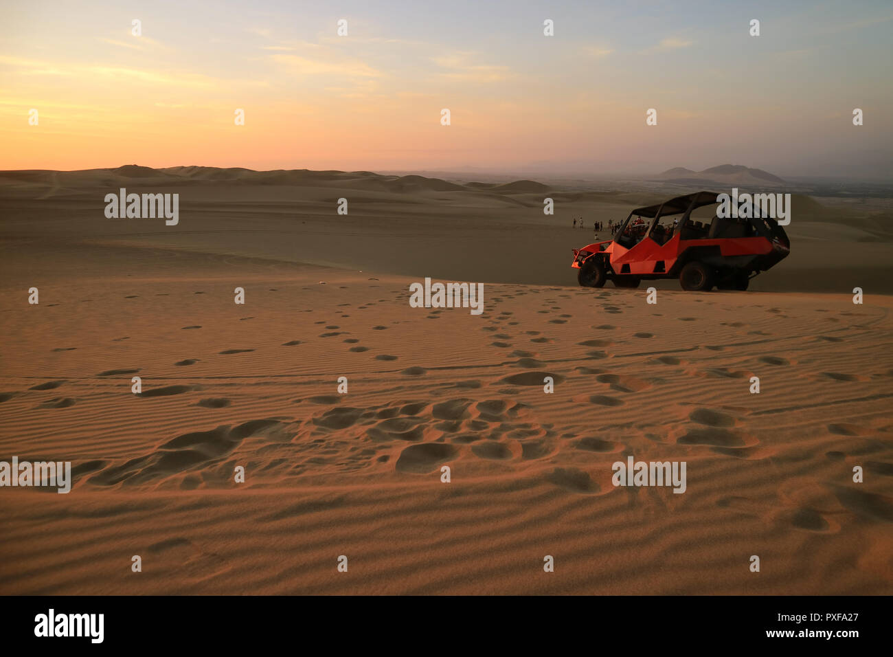 People enjoy dune buggy riding on Huacachina desert in Ica region of ...