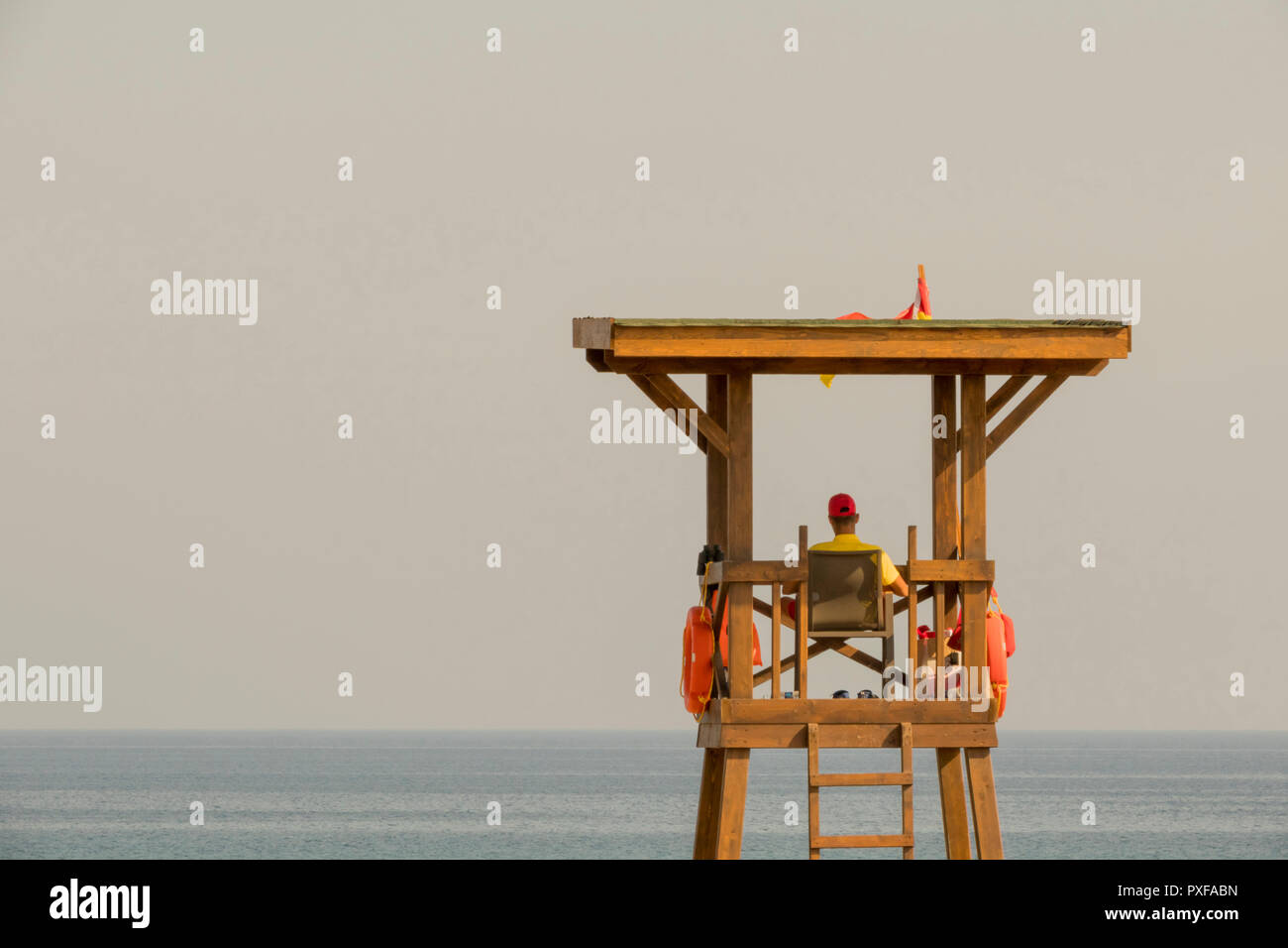 Beach lifeguard sitting in tower hi-res stock photography and images ...