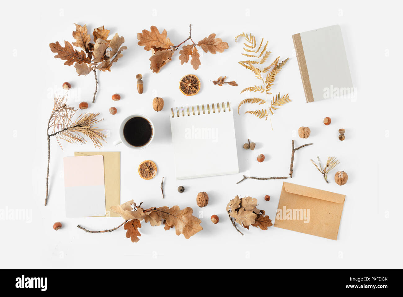 Autumn feminine workspace, desk with notepad, envelope, cup coffee ...