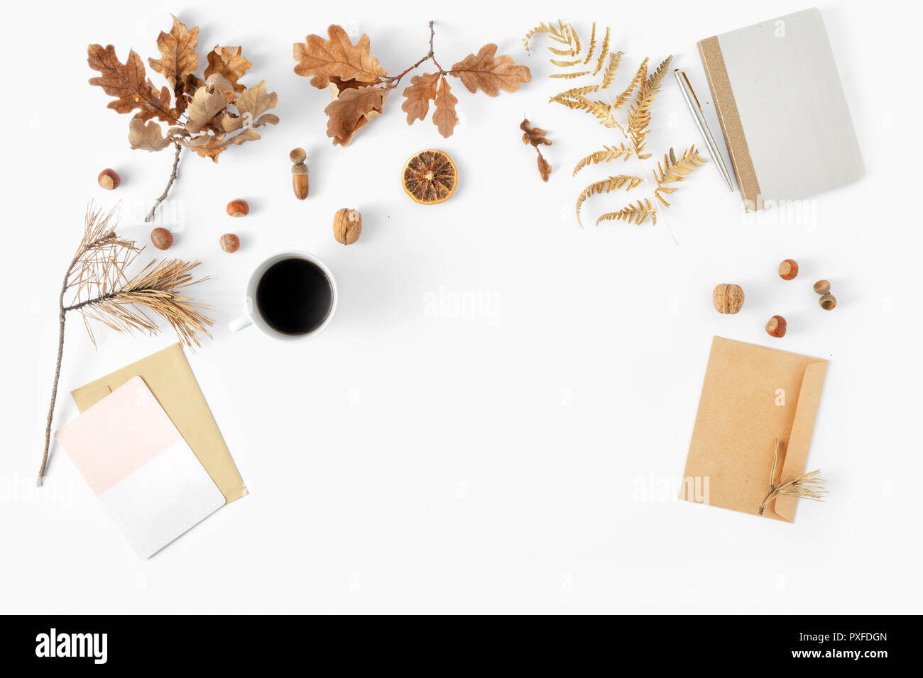 Autumn feminine workspace, desk with notepad, envelope, cup coffee ...