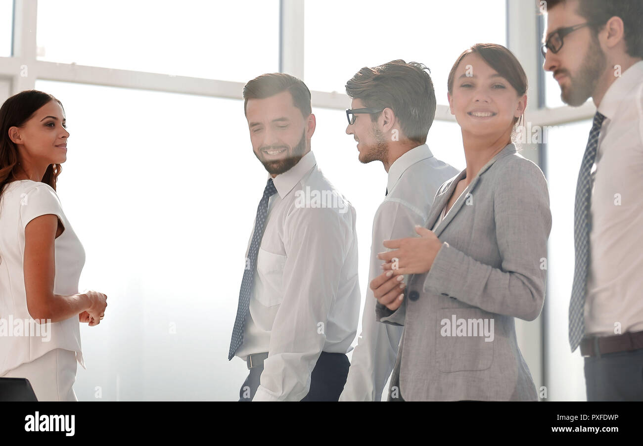 business team looks out the office window Stock Photo - Alamy