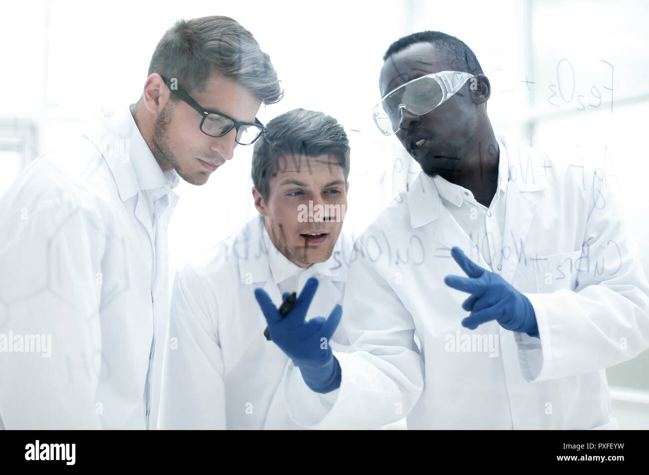 group of scientists talking in the laboratory Stock Photo - Alamy