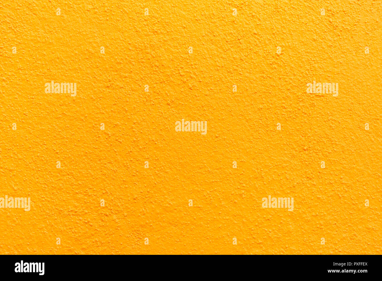 Stucco wall - Yellow stucco textured wall background with natural light ...