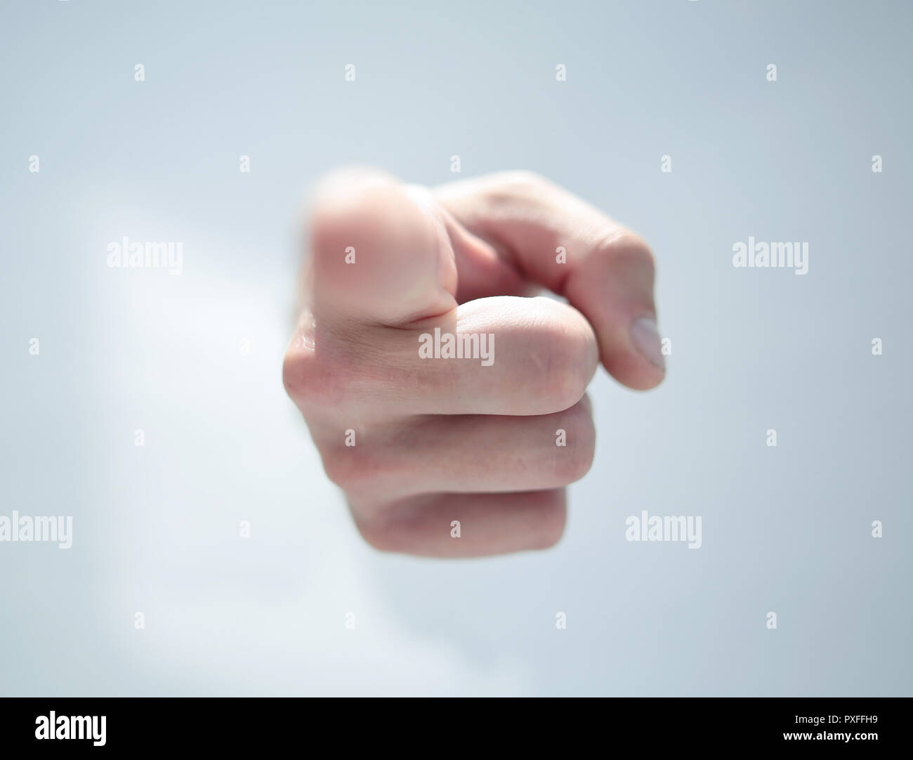 close up.a man's hand breaking through the paper and pointing so Stock ...