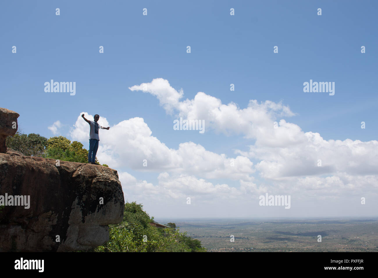 Man hanging on cliff hi-res stock photography and images - Alamy