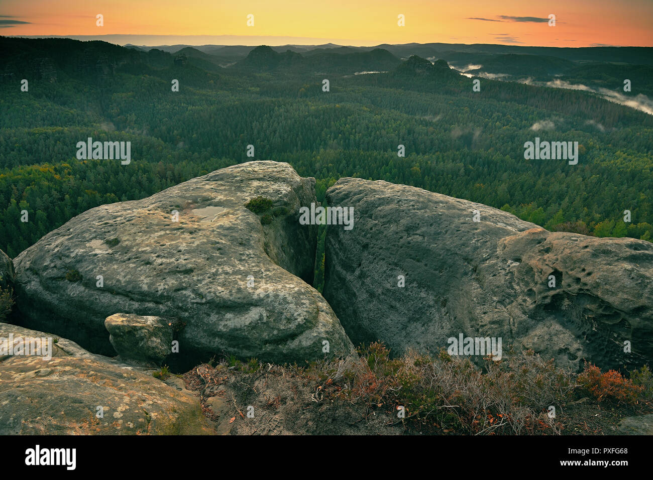 The rocky peak with daybreak. Full moon night ends and sun appeared in ...