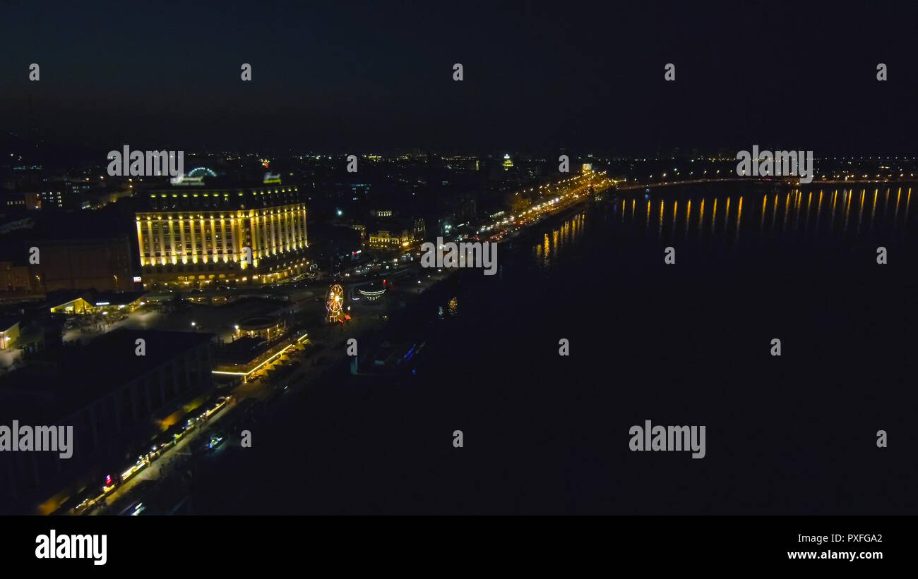 Aerial view from Drone: Top view of the night promenade with bridges ...