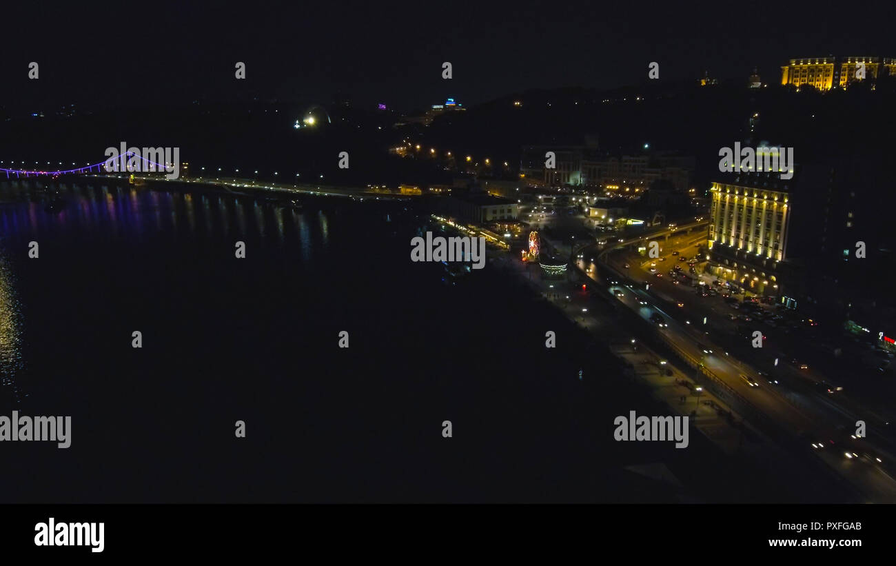 Aerial view from Drone: Top view of the night promenade with bridges ...