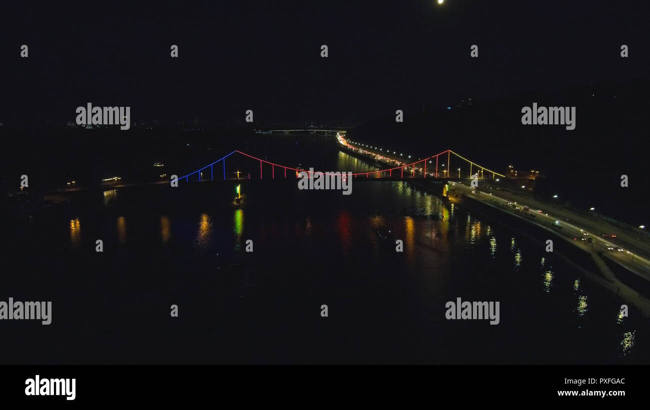 Aerial view from Drone: Top view of the night promenade with bridges ...