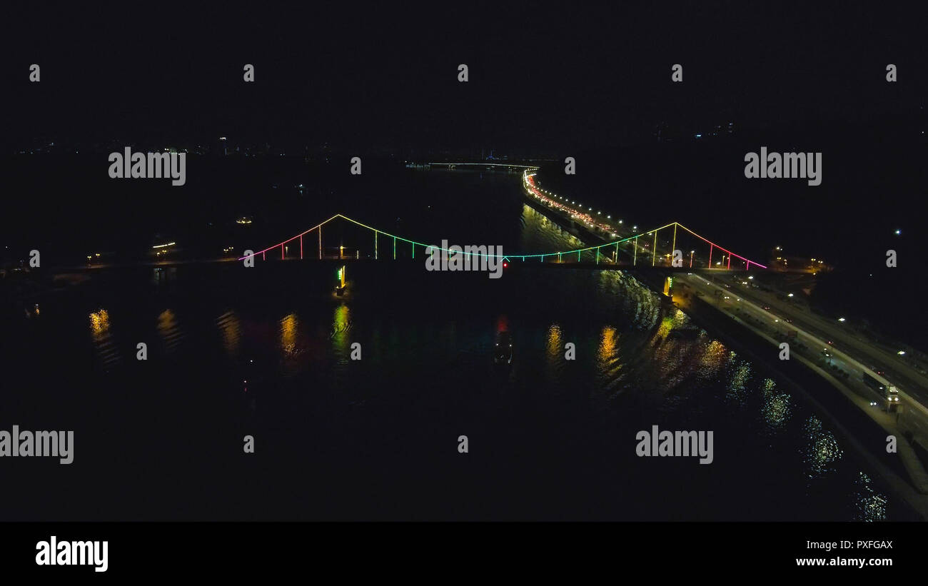 Aerial view from Drone: Top view of the night promenade with bridges ...