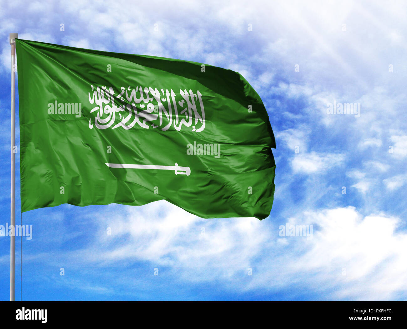 Saudi arabia flag on pole hi-res stock photography and images - Alamy
