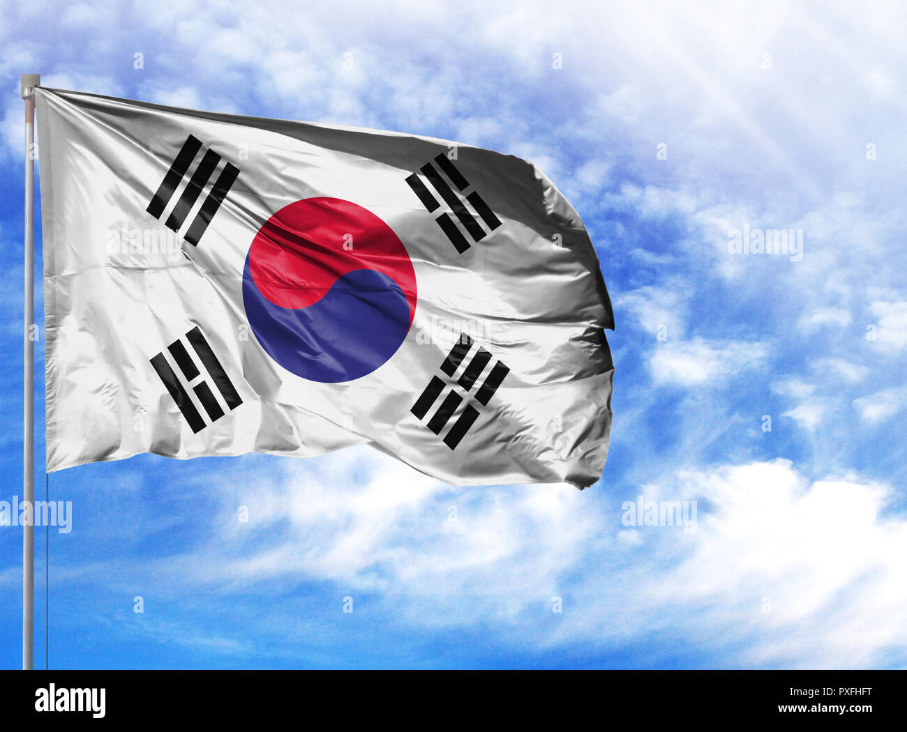 National flag of South Korea on a flagpole in front of blue sky Stock ...