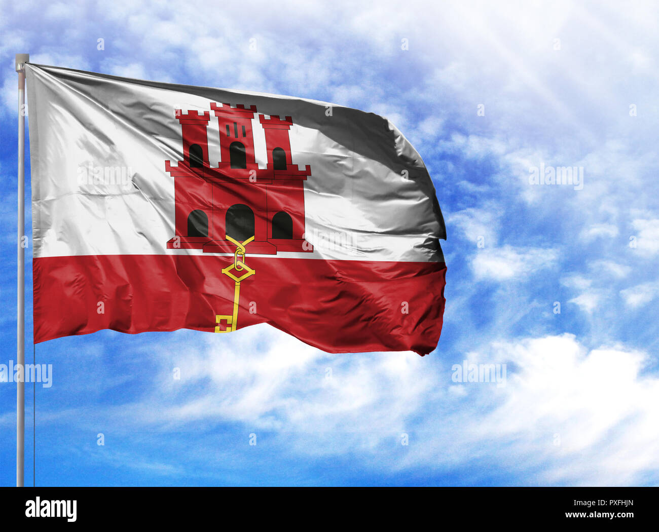 National flag of Gibraltar on a flagpole in front of blue sky Stock ...