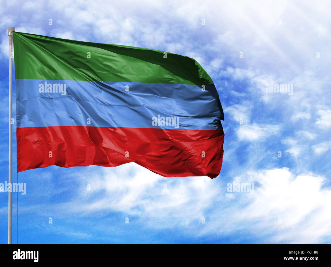 National flag of Dagestan on a flagpole in front of blue sky Stock ...