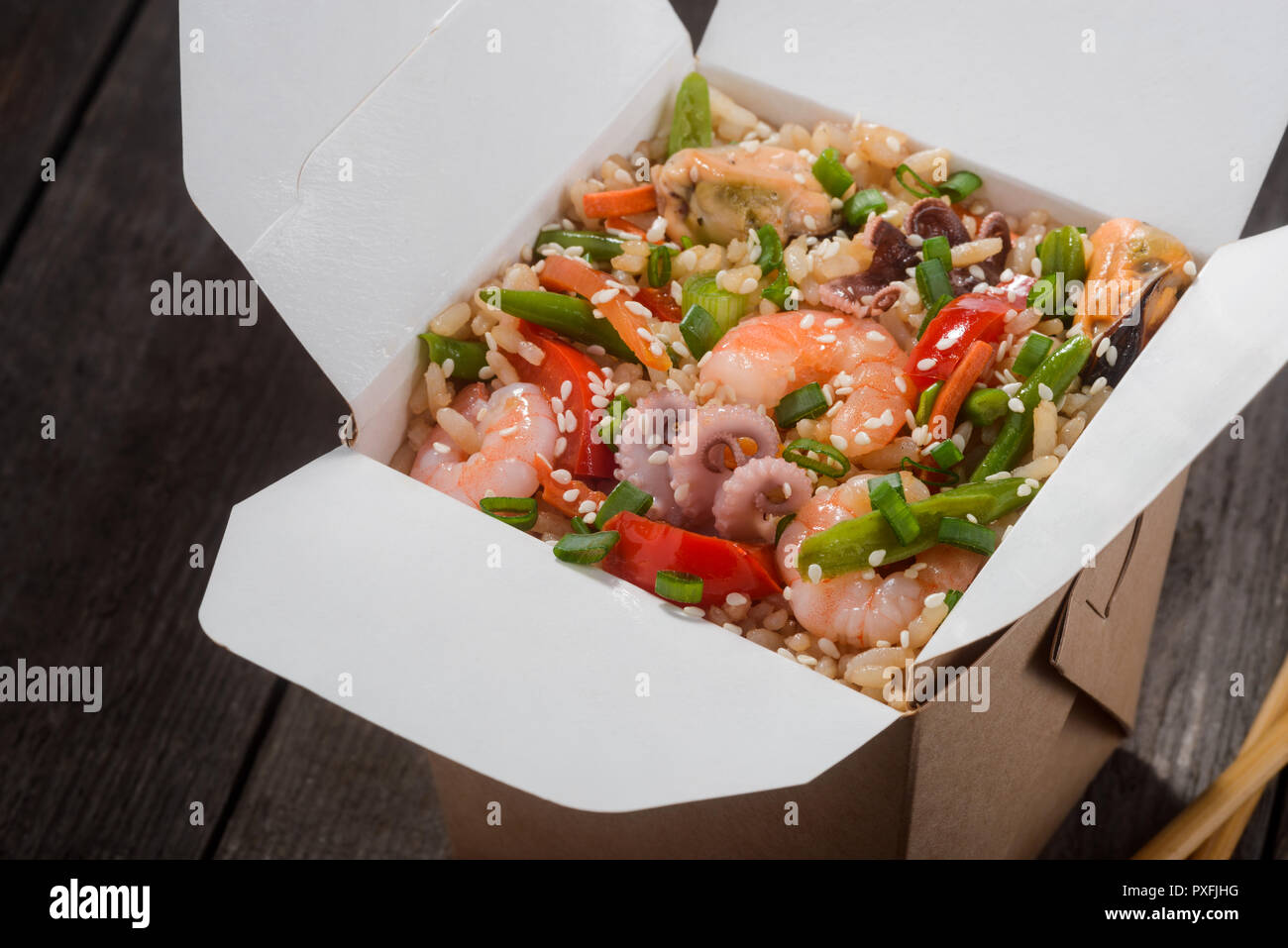 Fried seafood rice in box Stock Photo - Alamy
