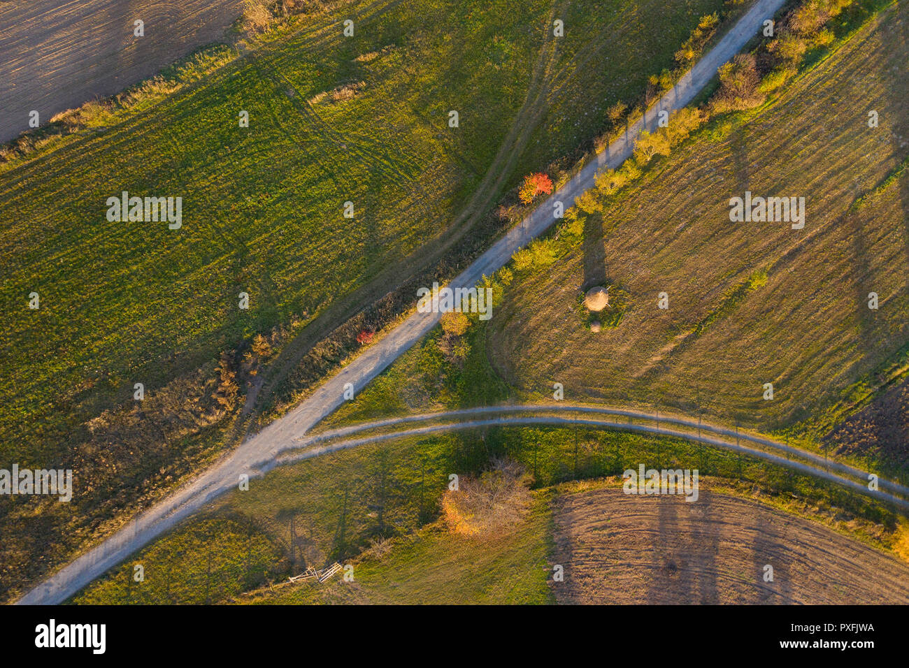 Aerial drone view of a countryside dirt road at autumn Stock Photo - Alamy