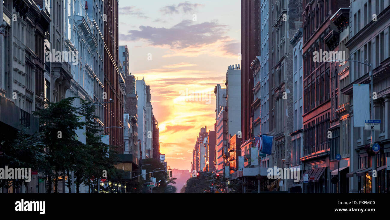 Colorful sunset sky between the buildings of Midtown Manhattan in New ...