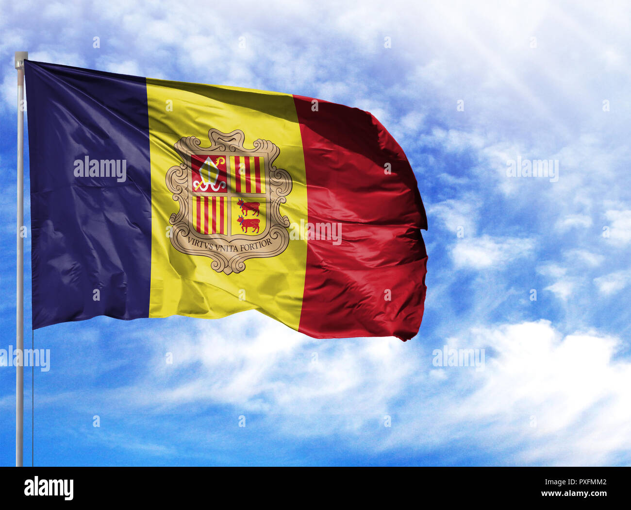 National flag of Andorra on a flagpole in front of blue sky Stock Photo ...