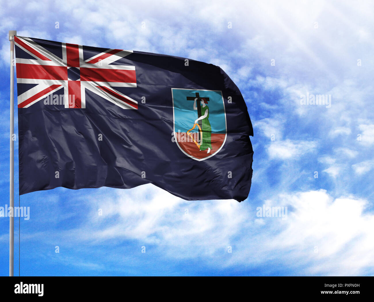 National flag of Montserrat on a flagpole in front of blue sky Stock ...