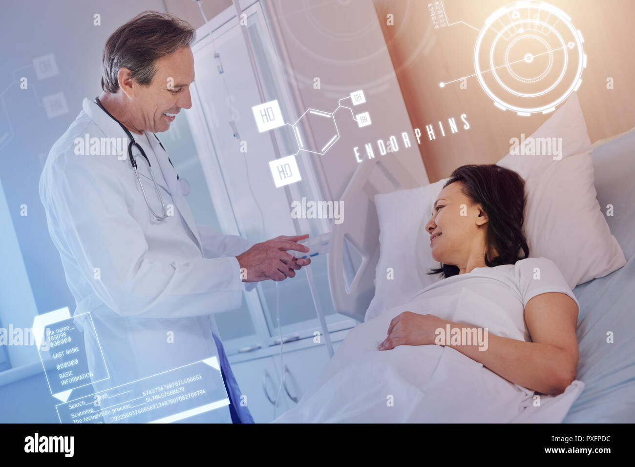 Calm patient smiling while a cheerful doctor giving her a pillbox Stock ...