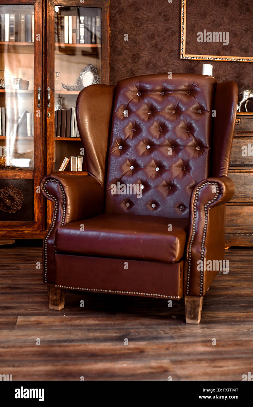 brutal leather empty chair in the office of a rich man or businessman ...