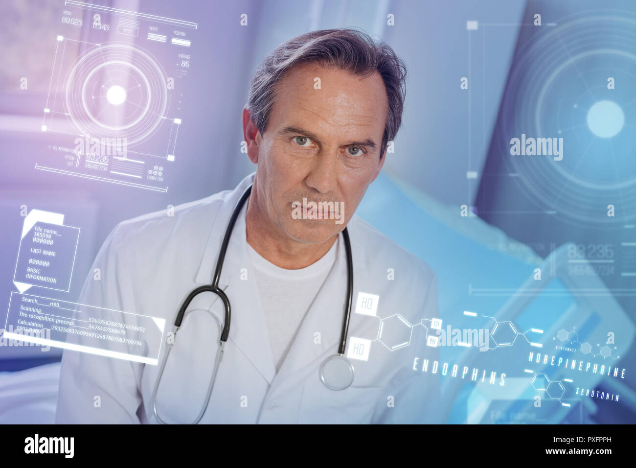 Calm doctor wearing a white uniform and having a stethoscope on his ...