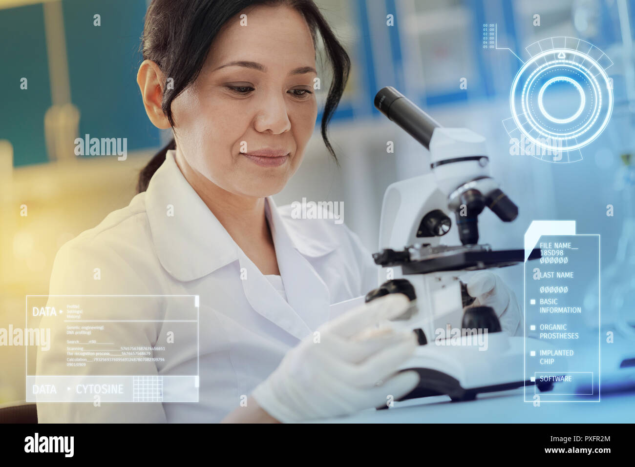 Professional scientist looking calm while working with a microscope ...