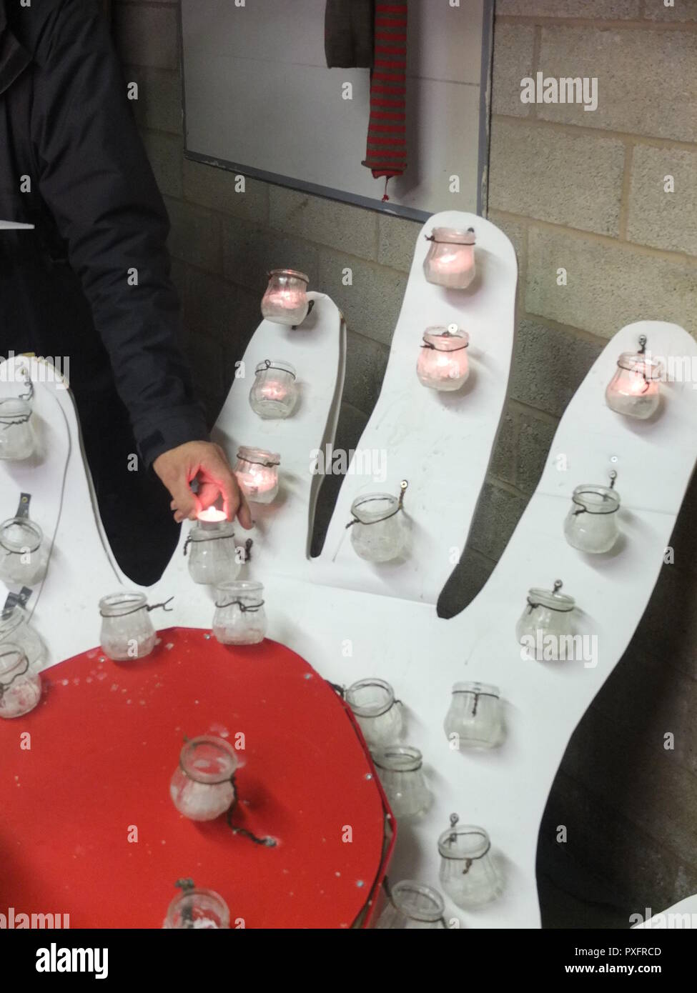 Lighting up traditional candle-lit boat prior to launch at Matlock Bath ...