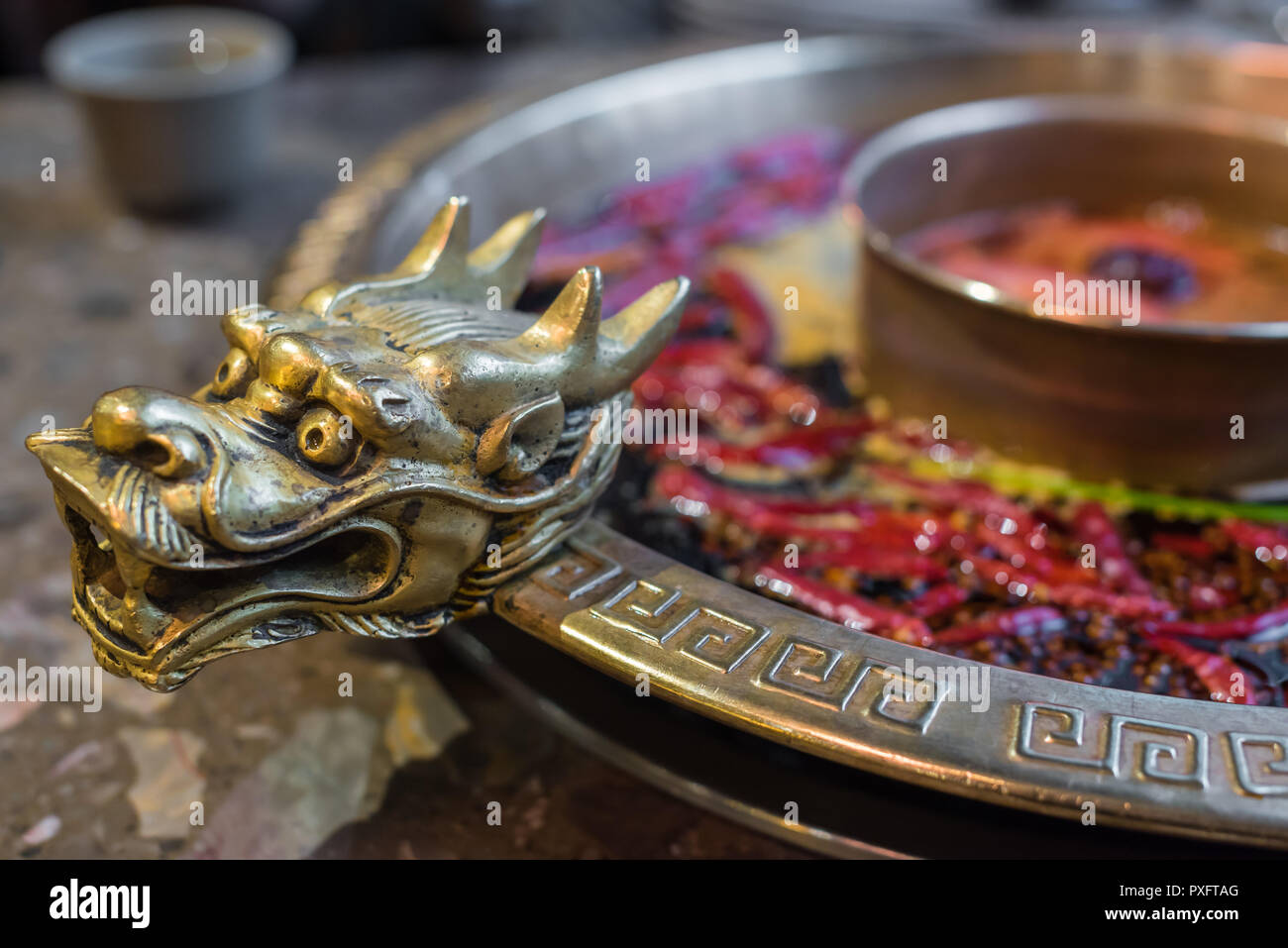 Chengdu Sichuan Hot Pot close up with dragon head sculpted handles ...