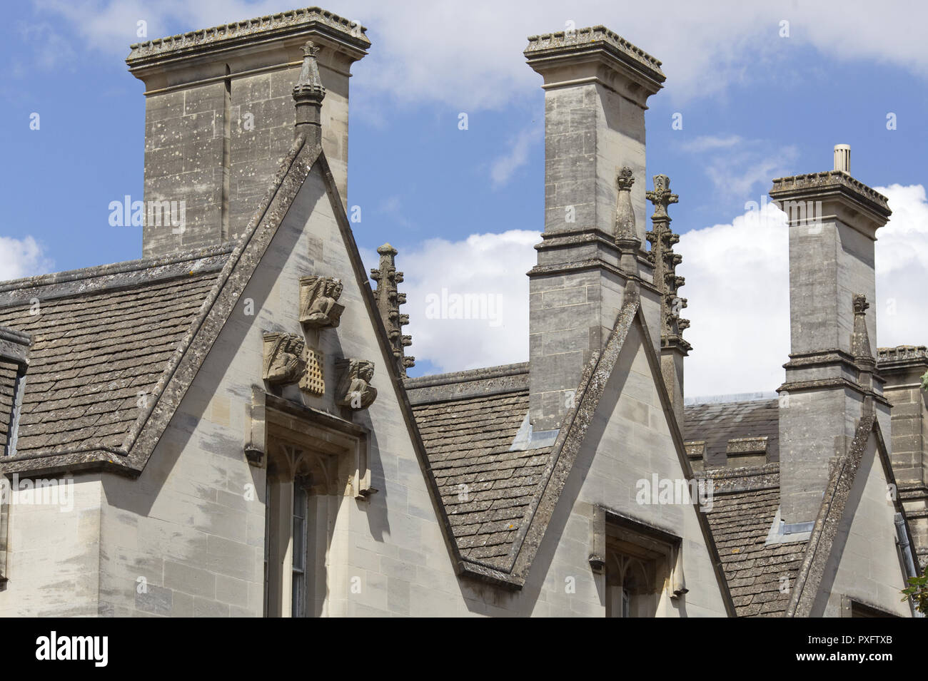 decorative stone chimney tops against a blue sky Stock Photo - Alamy