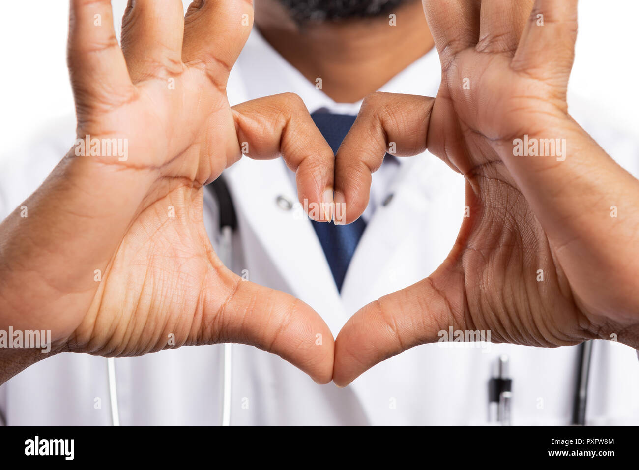 Close-up of heart gesture made by indian male cardiologist doctor or ...