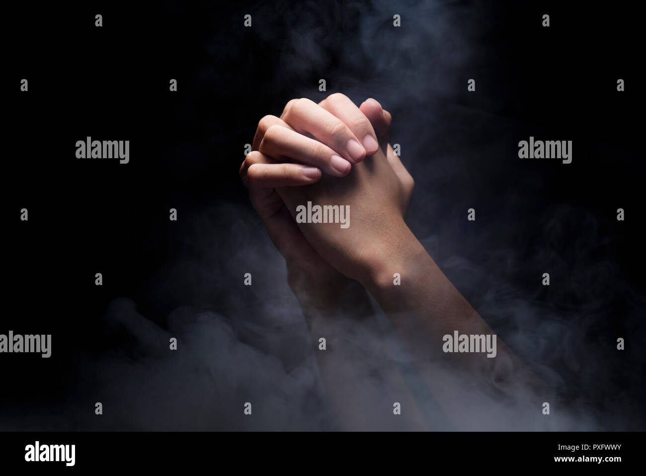 Praying hands over dark background. Christian Pray Stock Photo - Alamy