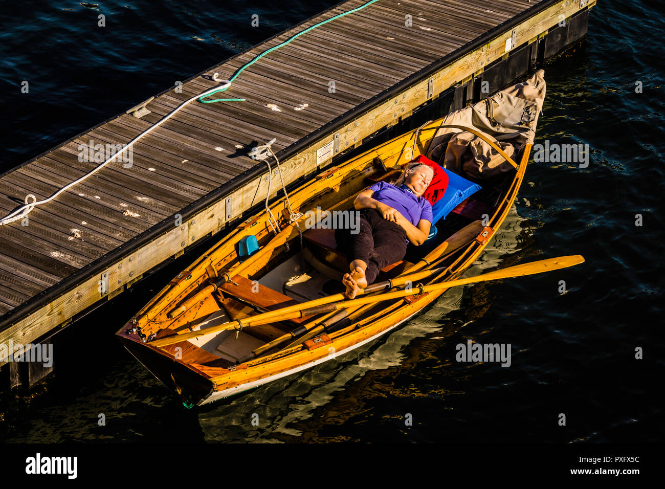 Woman Sleeping in Skiff Boston Harbor Boston, Massachusetts, USA Stock ...