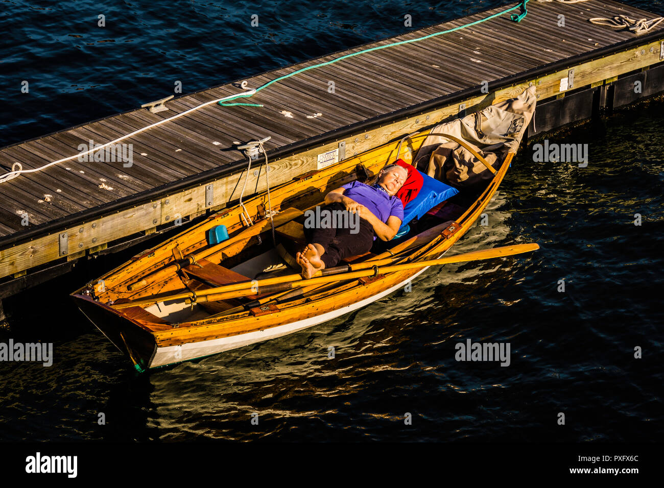 Woman Sleeping in Skiff Boston Harbor Boston, Massachusetts, USA Stock ...