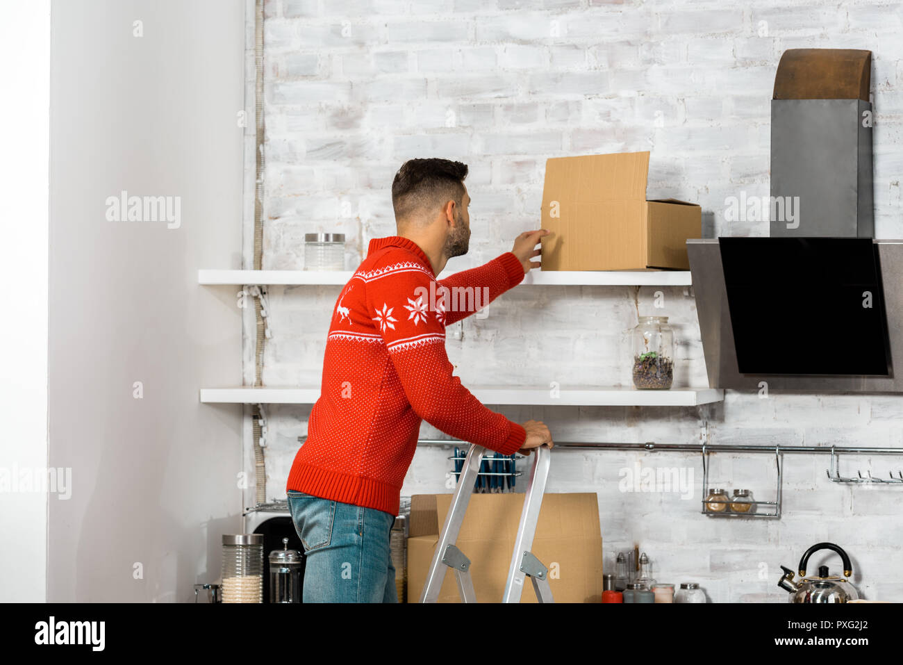 Putting box on shelf hi-res stock photography and images - Alamy
