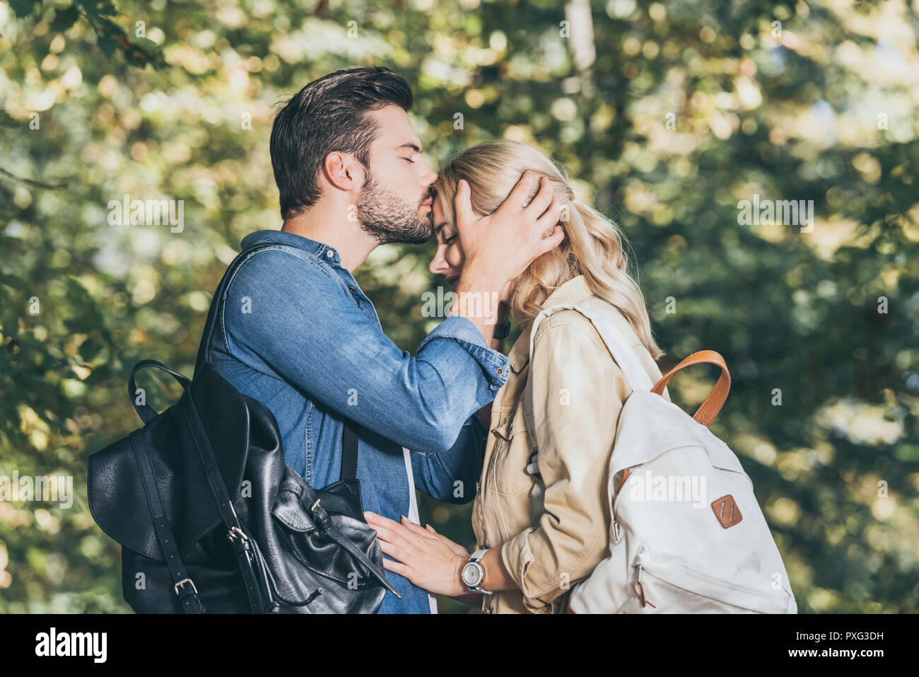 side view of romantic couple in autumn park Stock Photo - Alamy