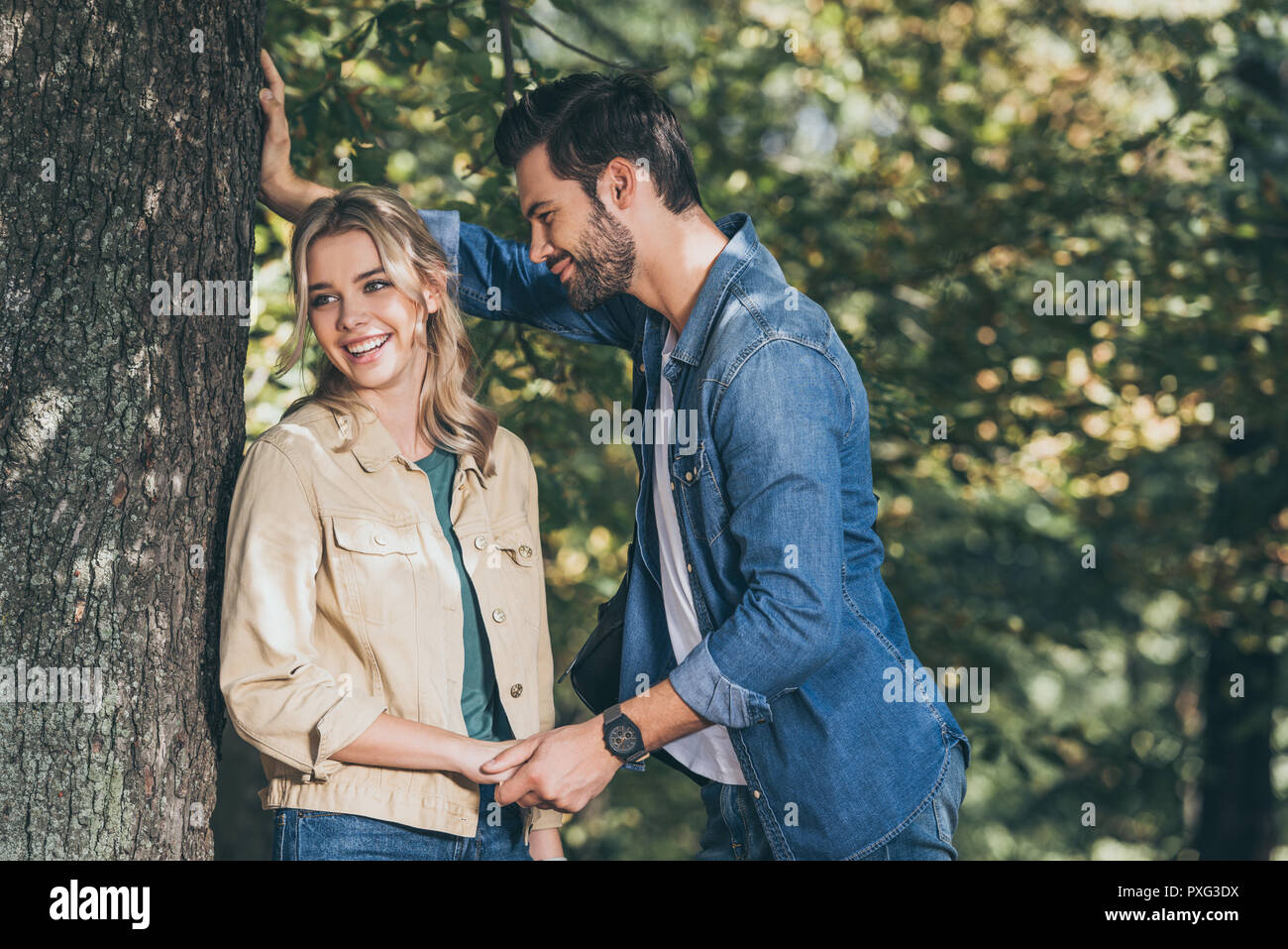 Happy romantic couple holding hands hi-res stock photography and images ...