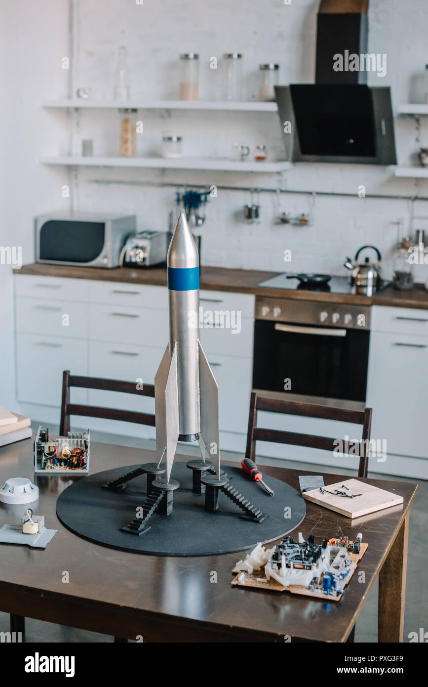 rocket model and tools for designing on table in kitchen Stock Photo ...