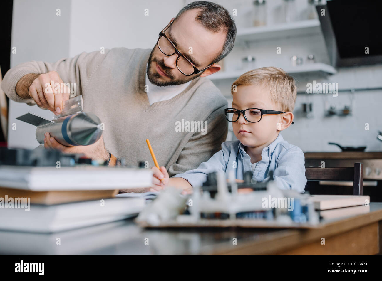 Father boy model rocket hi-res stock photography and images - Alamy