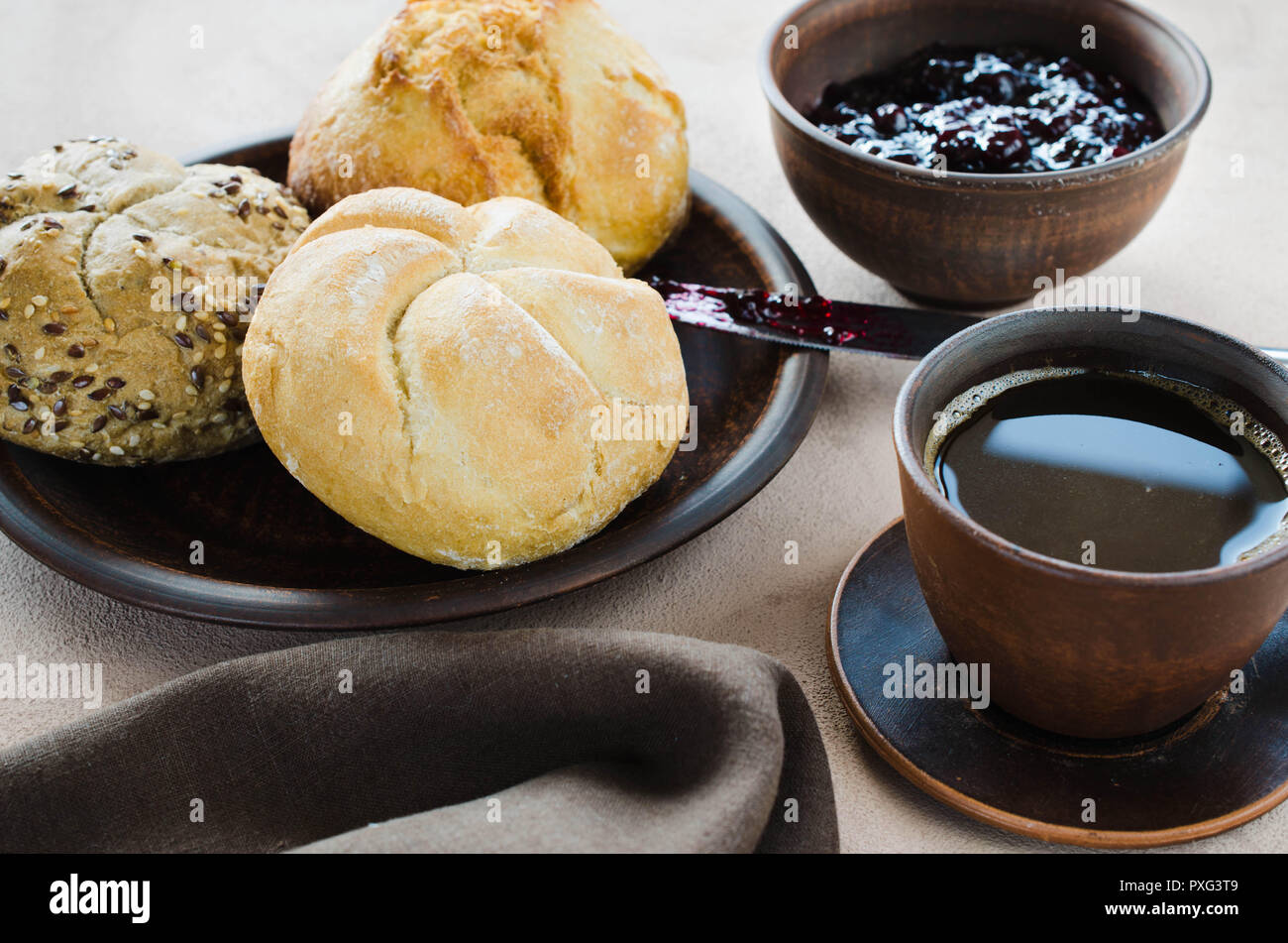 Coffee americano, fresh buns and jam. Simple breakfast in morning ...