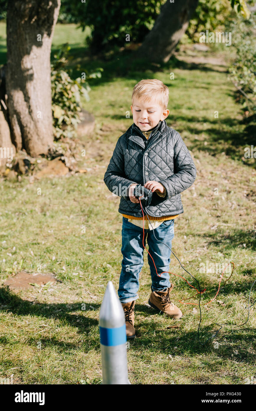 adorable child launching model rocket outdoor Stock Photo - Alamy