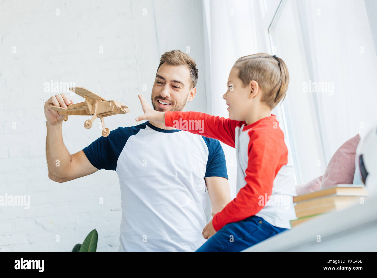 Father take child toy hi-res stock photography and images - Alamy