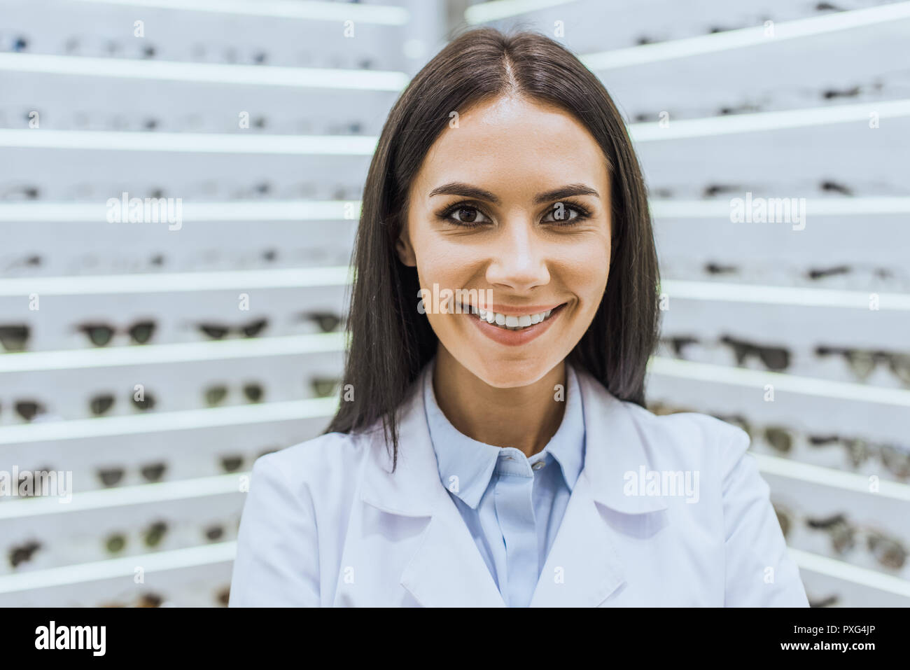 professional smiling optometrist in white coat looking at camera Stock ...